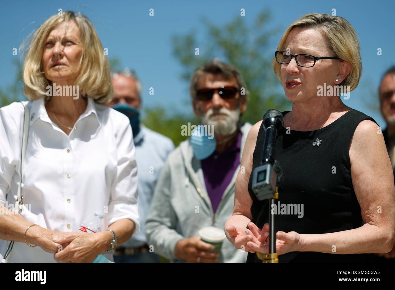 Janet Johnson of Pawcatuck, Ct., left, and her husband, Norman, center ...