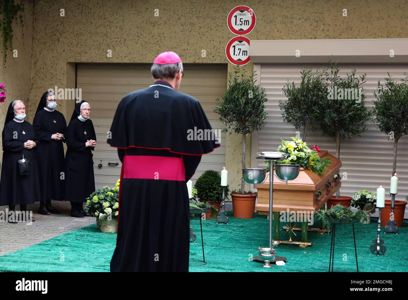 Nuns stand at the coffin of Georg Ratzinger in Regensburg, Germany ...