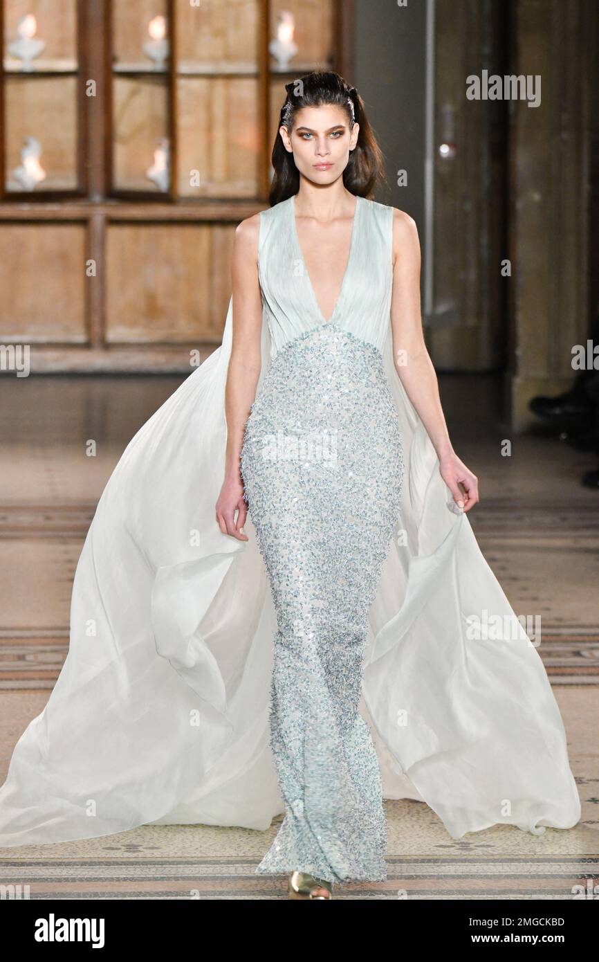 Paris, France. 25th Jan, 2023. A model walks the runway at the Rami Al ...