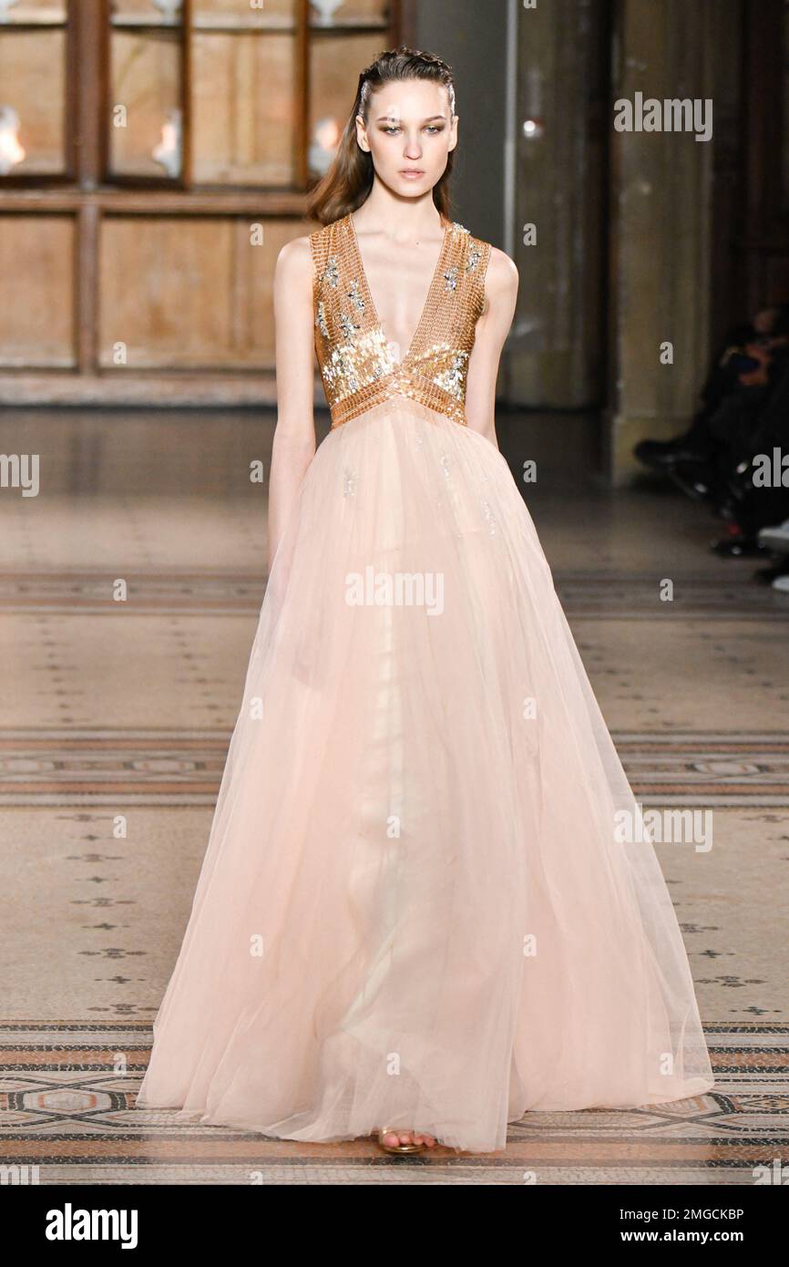 Paris, France. 25th Jan, 2023. A model walks the runway at the Rami Al ...