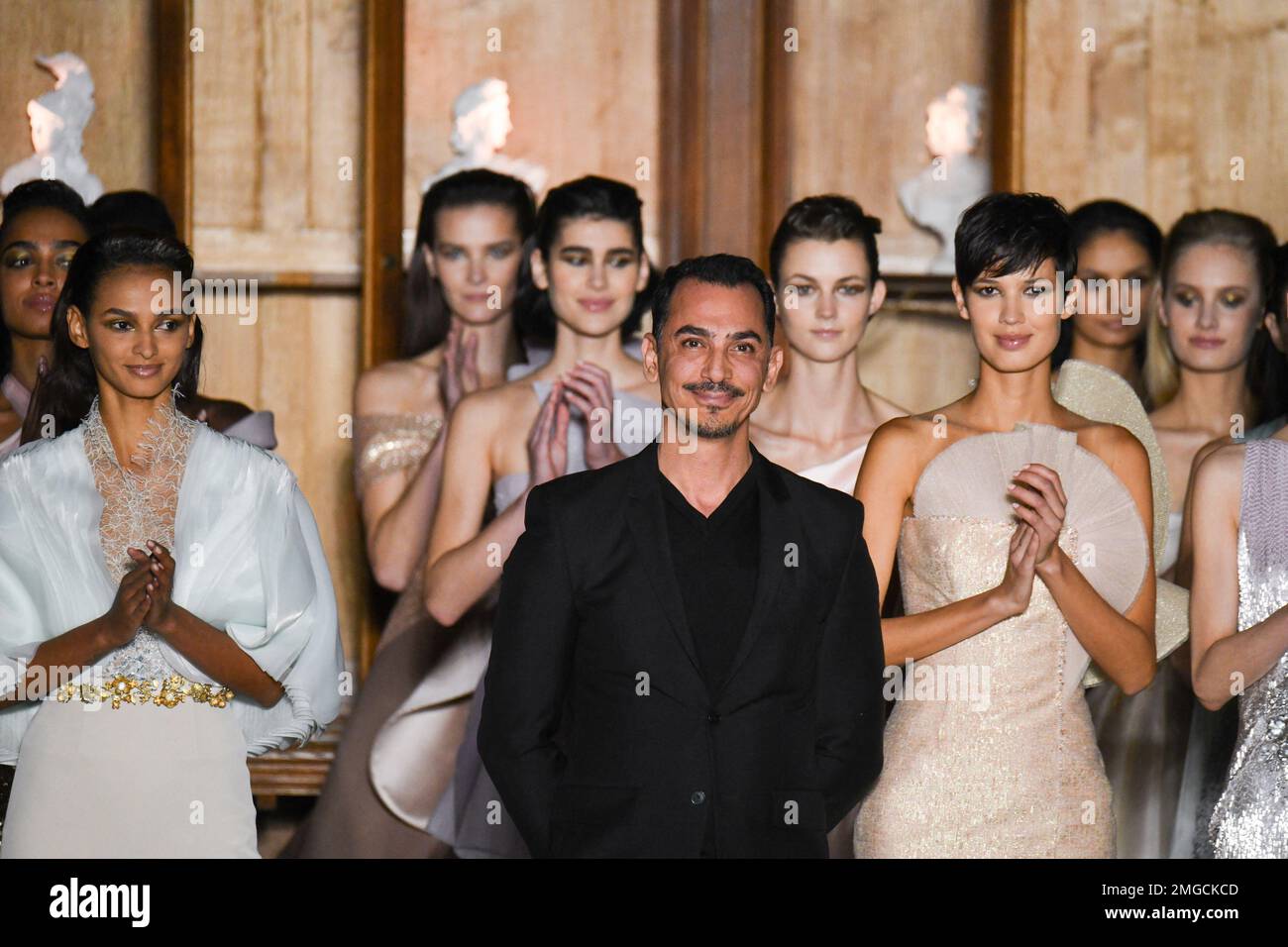 Paris, France. 25th Jan, 2023. A model walks the runway at the Rami Al ...