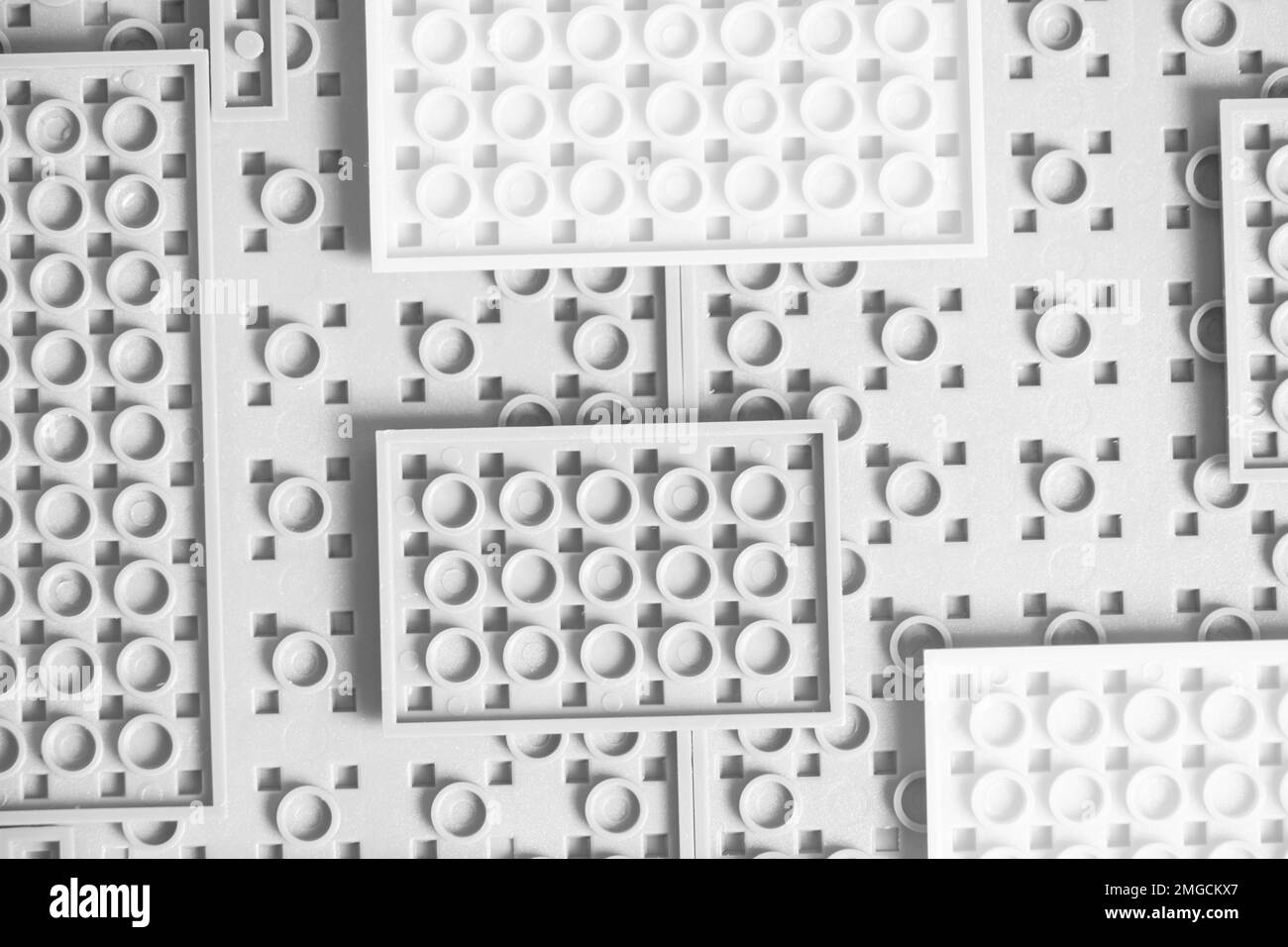 Abstract relief background, texture white children lego Stock Photo - Alamy