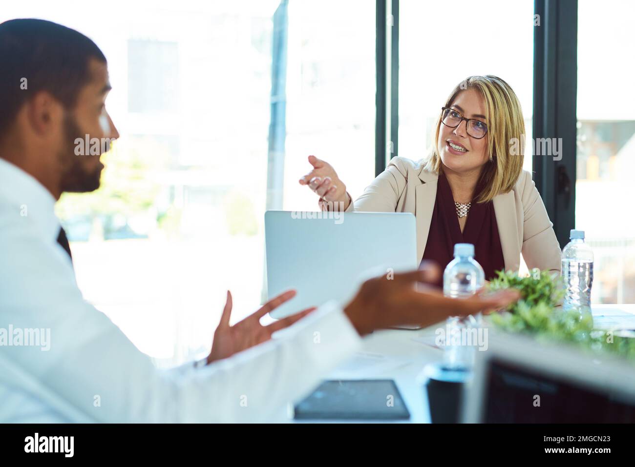 Communication at work is important. businesspeople in the workplace ...