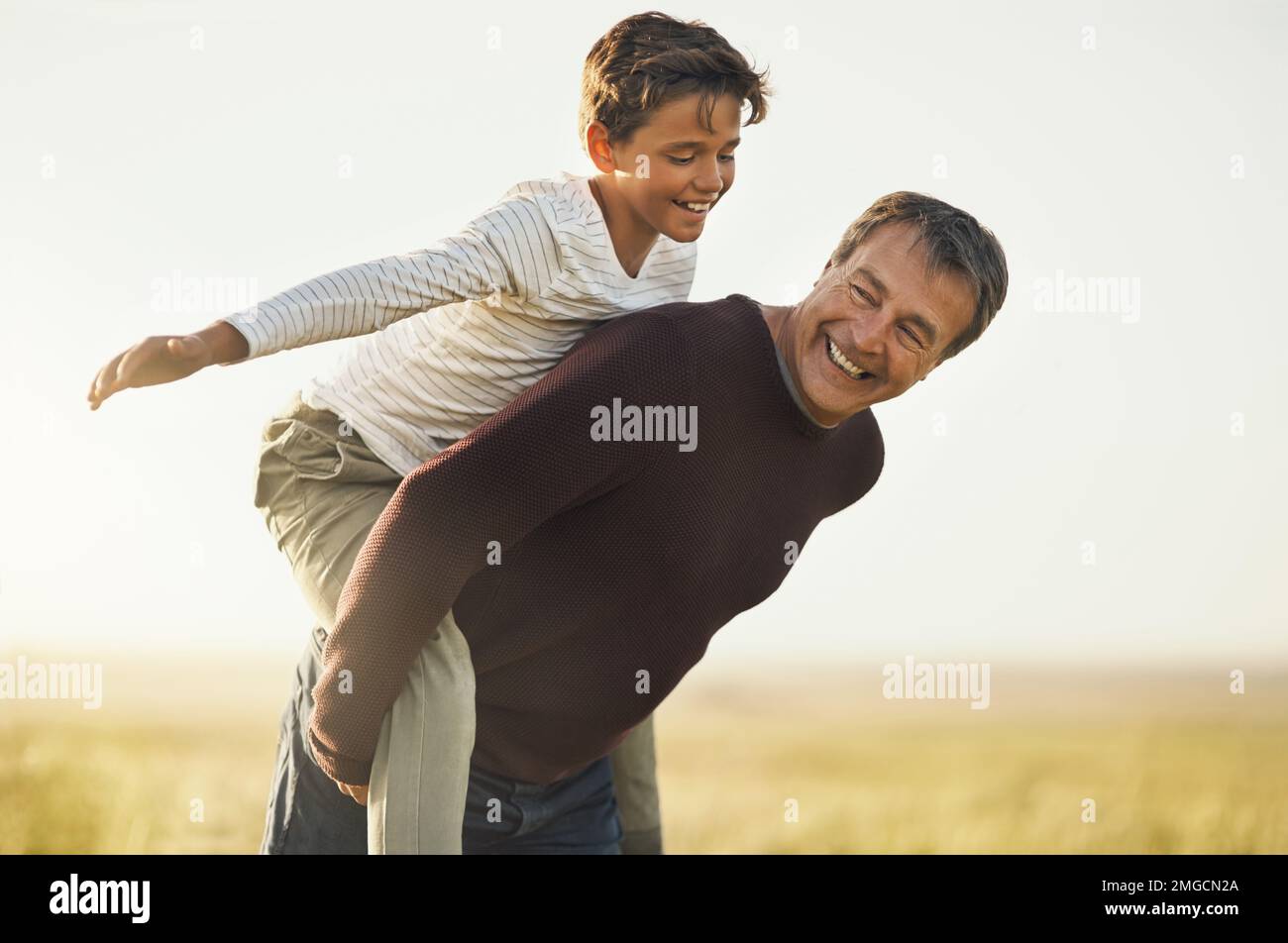 Give them your time. a father and son having a good time as the father ...