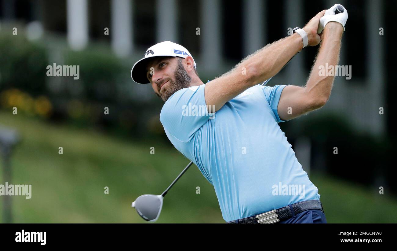 Dustin Johnson tees off on the 18th hole during the final round of the ...