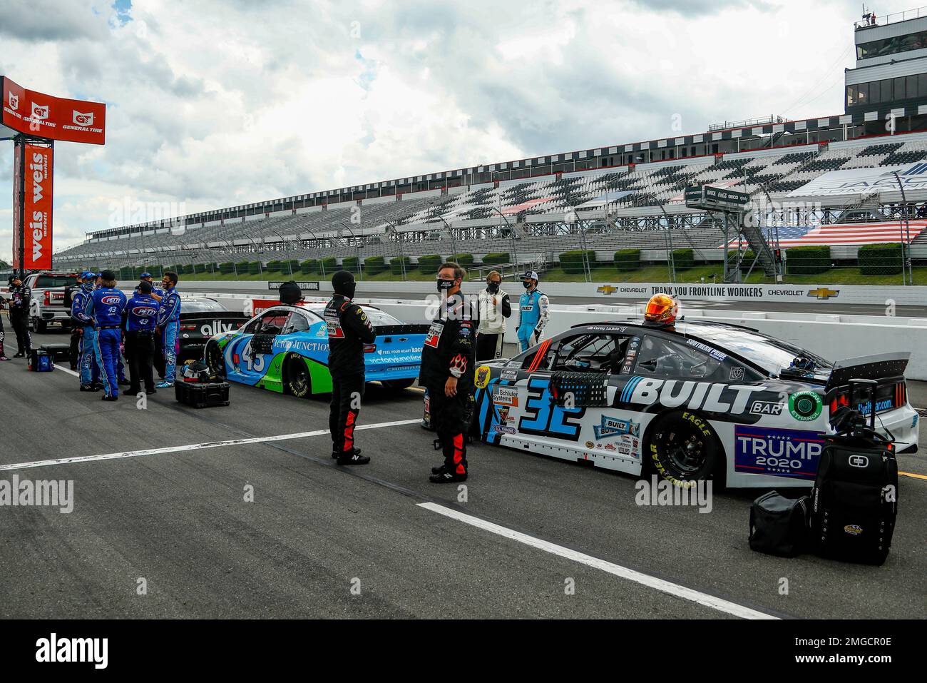 Drivers and crews line up on pit row before the start of the NASCAR Cup ...