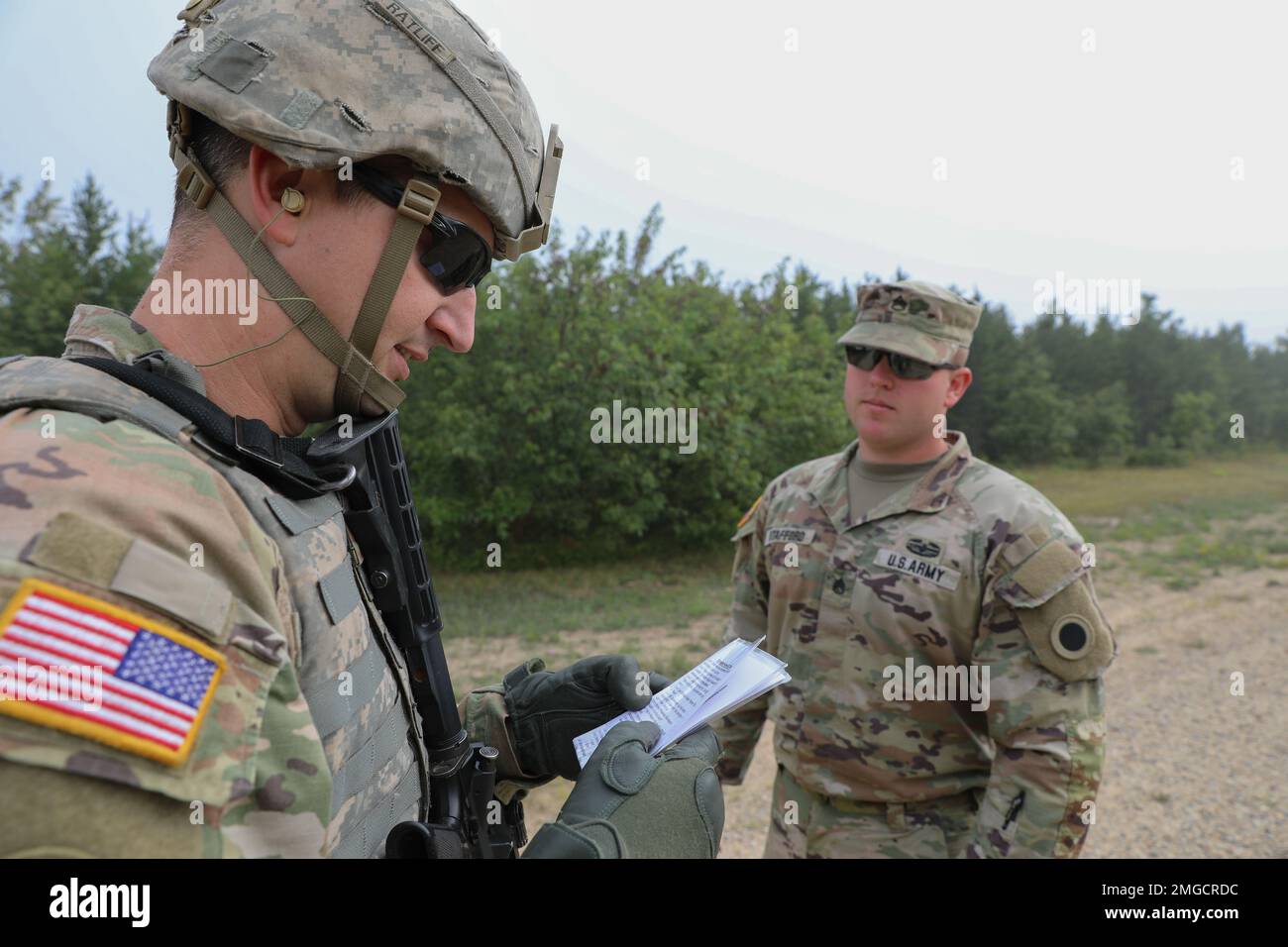 U.S. Army Master Sgt. Matthew Ratliff, left, senior supply sergeant, Headquarters and ...