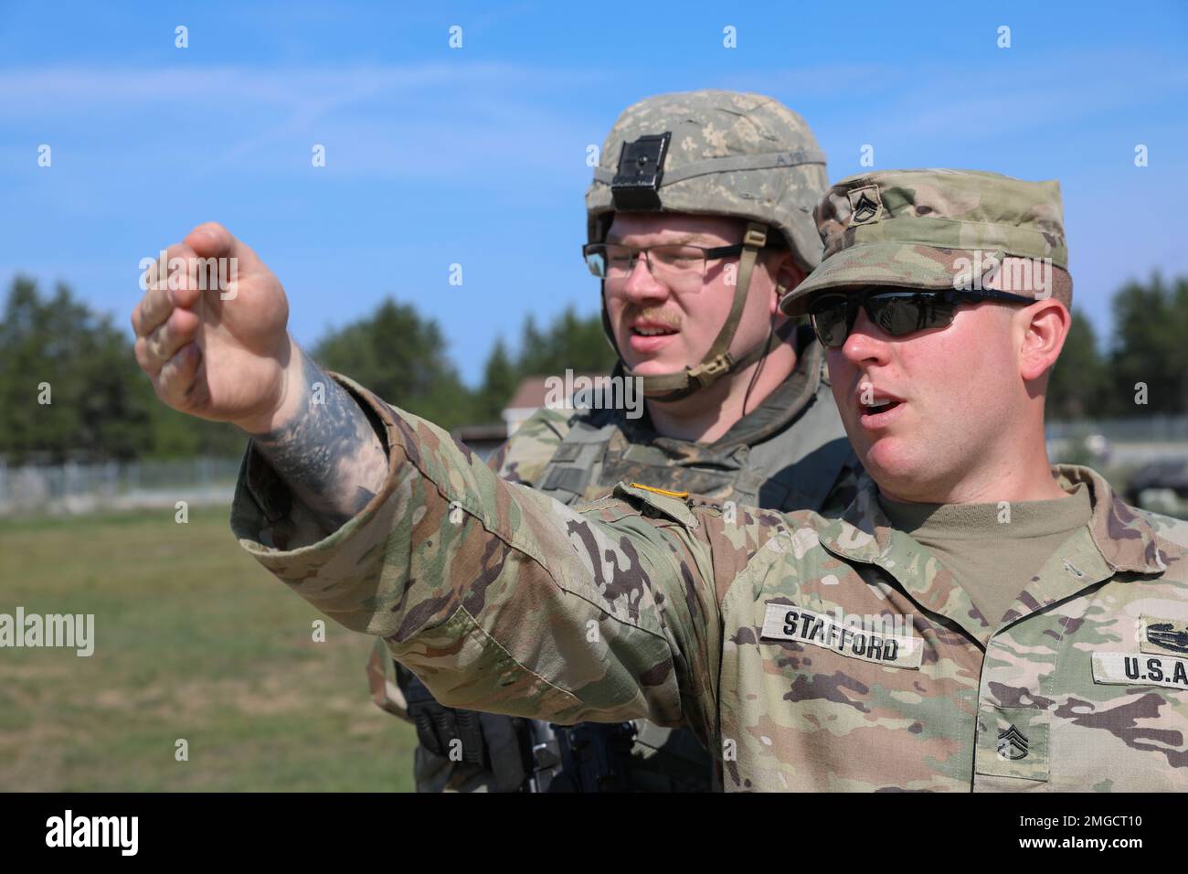 U.S. Army Spc. Gregory Packard, left, cable systems installer ...