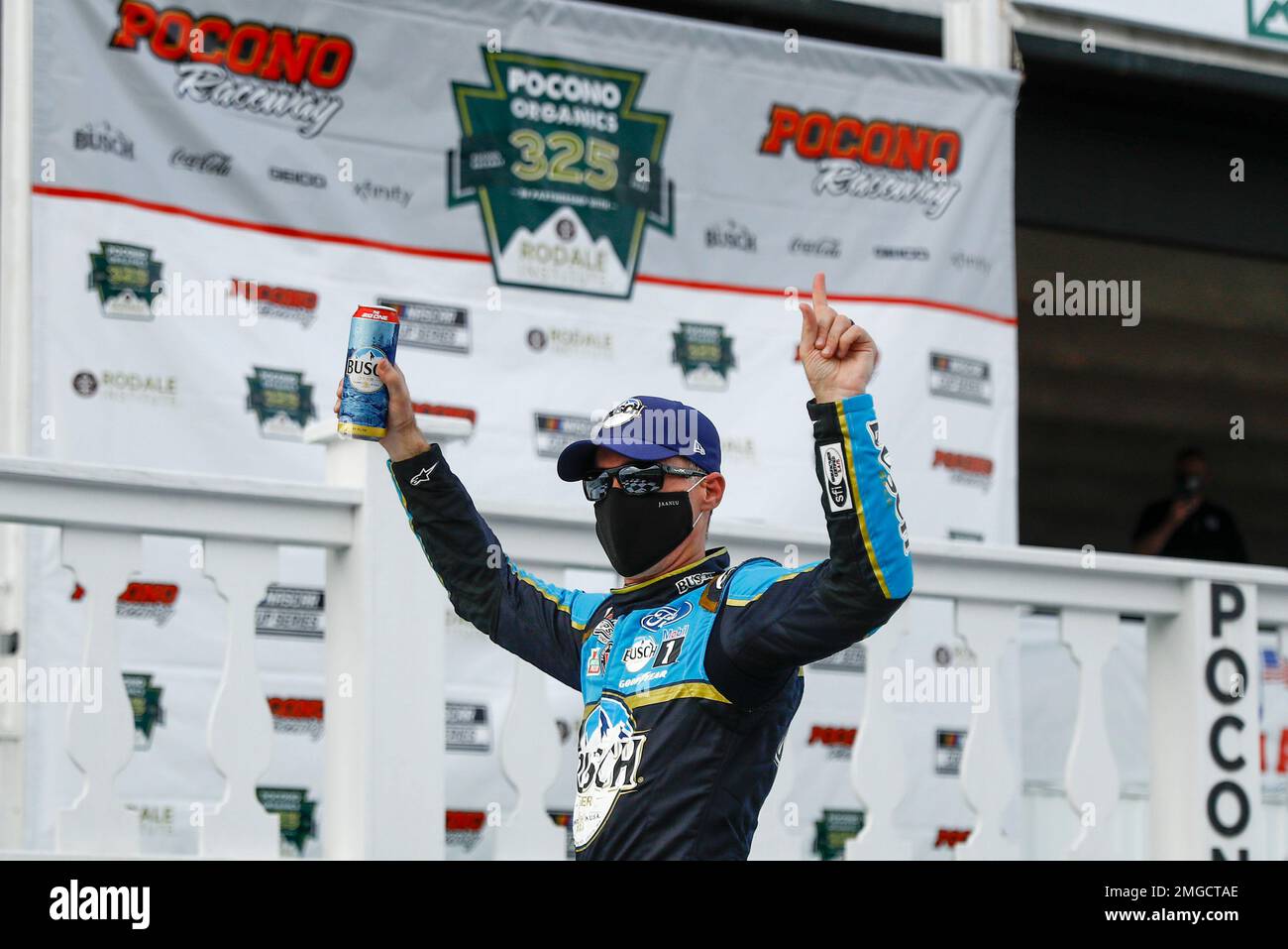 Kevin Harvick celebrates in the winners circle after winning the NASCAR ...