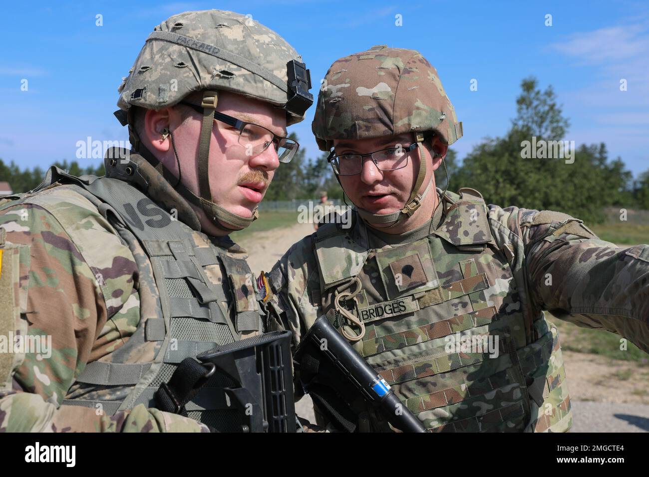 U.S. Army Spc. Gregory Packard, left, cable systems installer ...