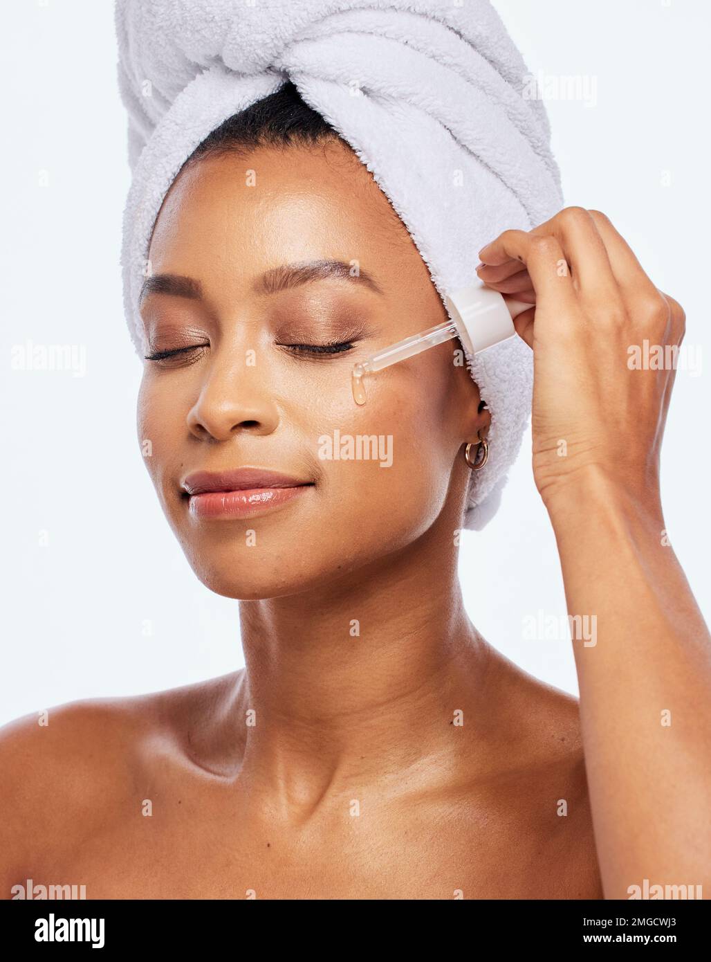 Beauty, skincare oil and face of a woman in studio for dermatology ...