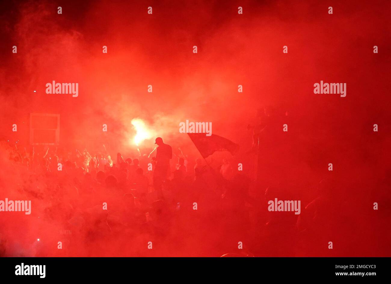 Liverpool supporters celebrate as they gather outside of Anfield ...