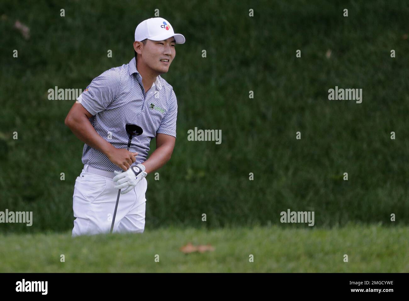 Sung Kang, of South Korea, watches his tee shot from the 15th hole ...