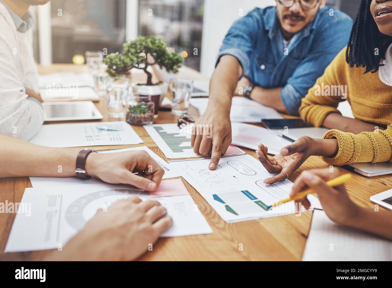 Whats this. High angle shot of a group of businesspeople discussing ...
