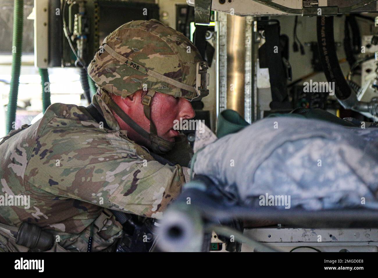 Spc. Joel Snyder, a combat medic assigned to 52nd Brigade Engineer ...
