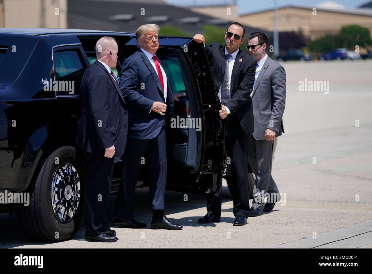 President Donald Trump exits a vehicle before boarding Air Force One ...