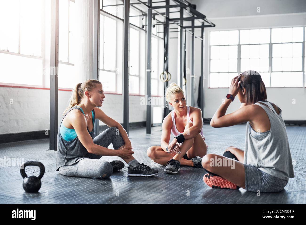 Coming together for their usual post-workout chats. a group of young ...