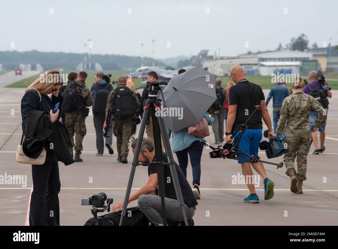 Polish media walk to take photos of the Polish Air Force F-16 assigned ...