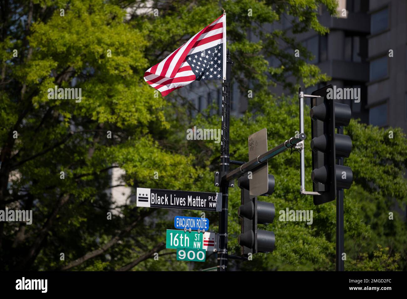 An American flag flies upside-down on the corner of 16th Street, NW ...