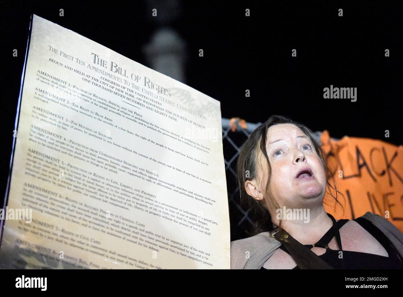 A woman protests against the removal of a statue of former U.S. Vice ...