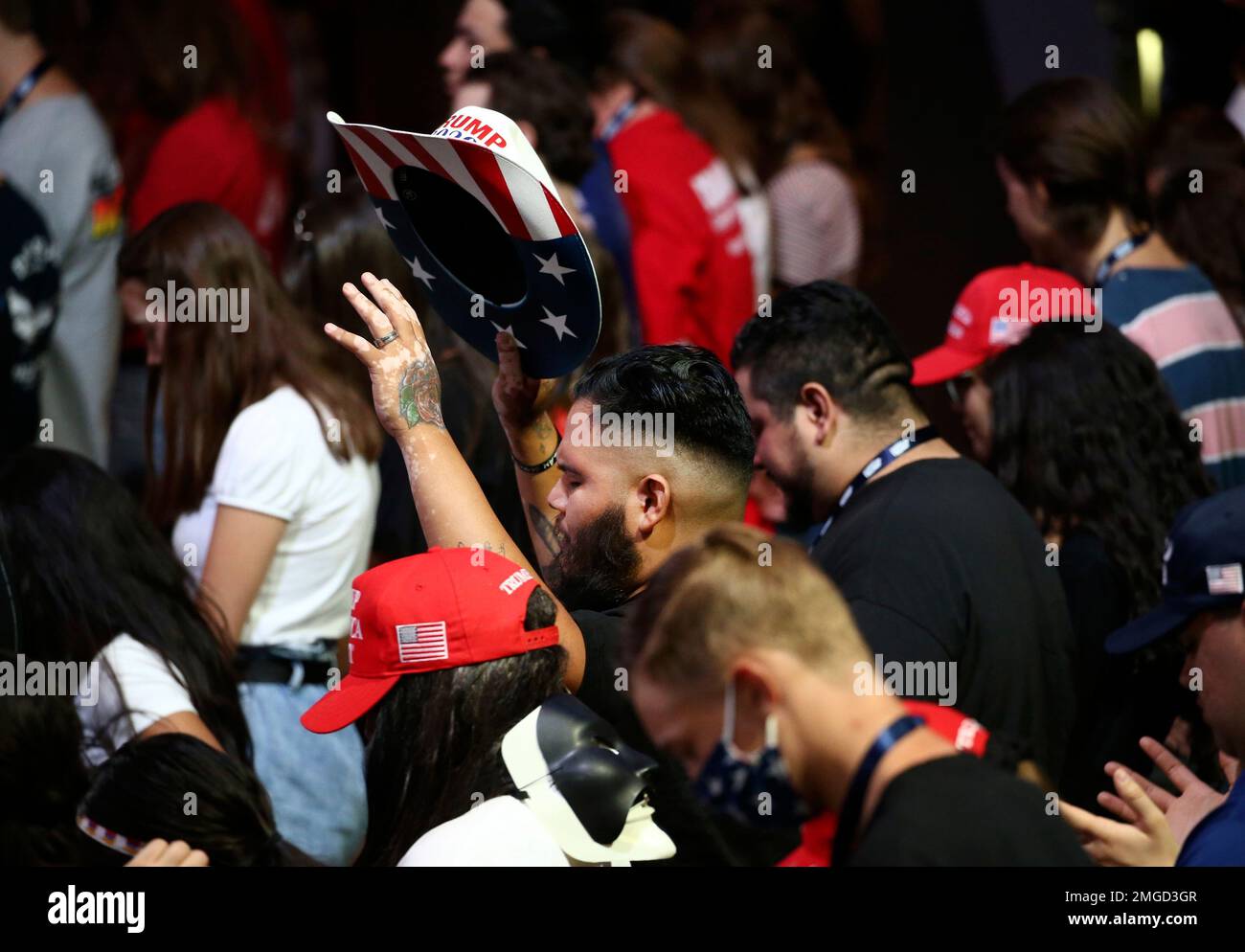 Students for Trump attendees pray prior to President Donald Trump ...