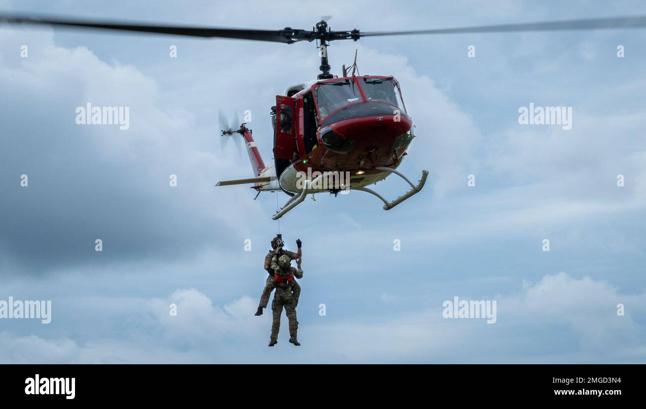 A 413th Flight Test Squadron UH-1 Huey carries two 20th Air Support ...