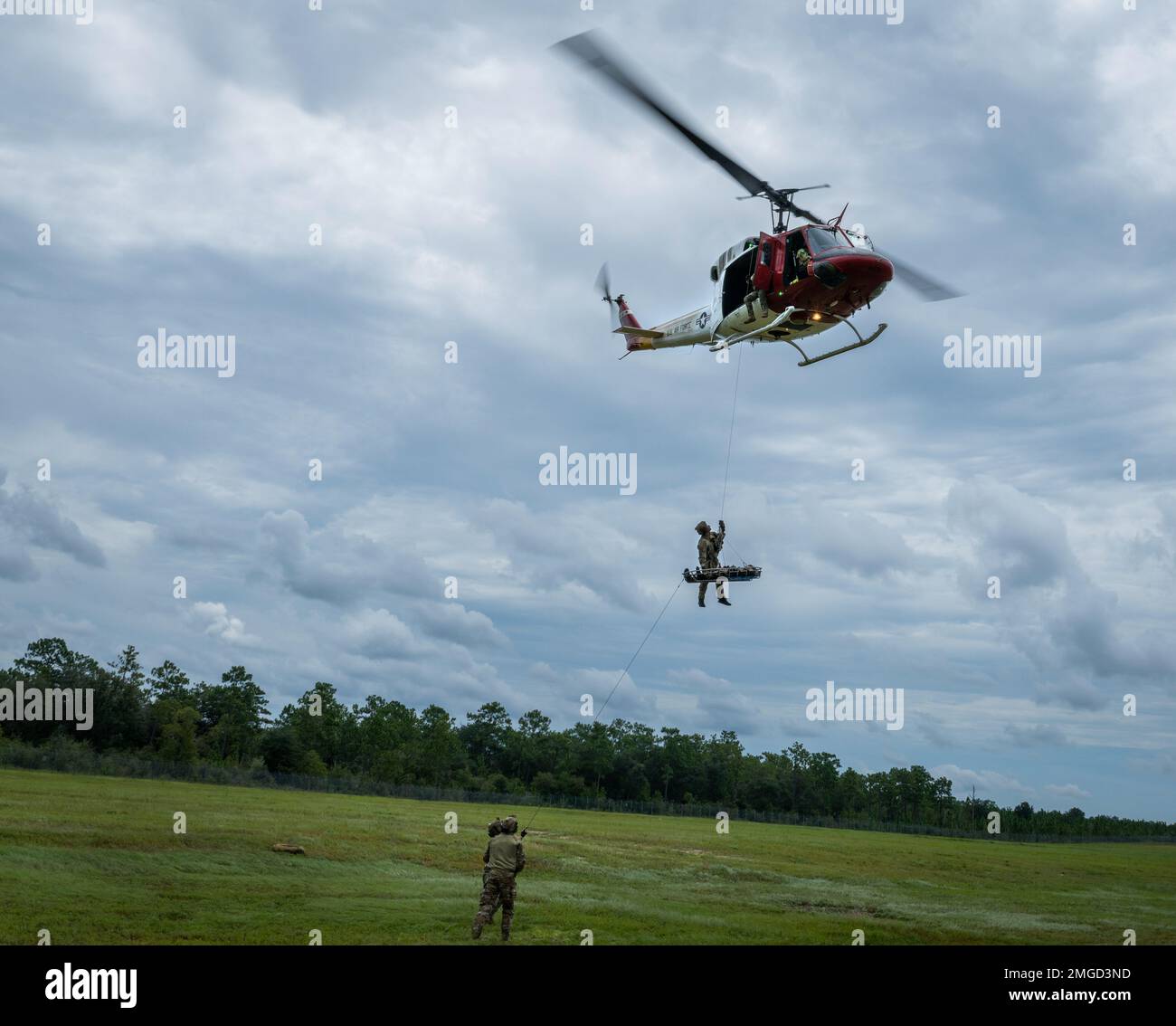 A 413th Flight Test Squadron UH-1 Huey lifts two 20th Air Support ...