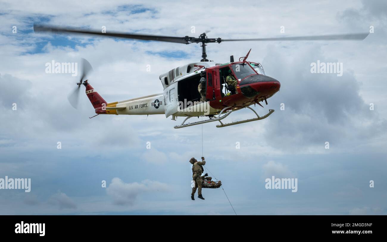 A 413th Flight Test Squadron UH-1 Huey lifts two 20th Air Support ...