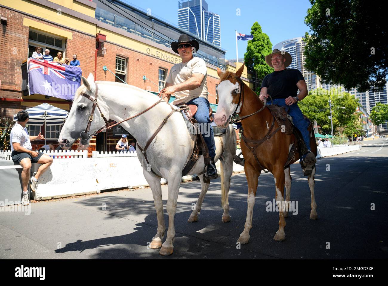 Michael Flanagan (left) and Mark Brine ride their horses down Cumberland street during Australia ...