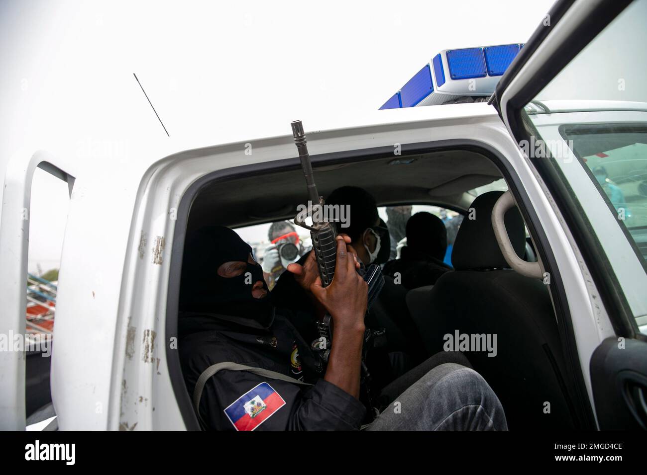 Former paramilitary leader Emmanuel Constant is loaded into a police ...