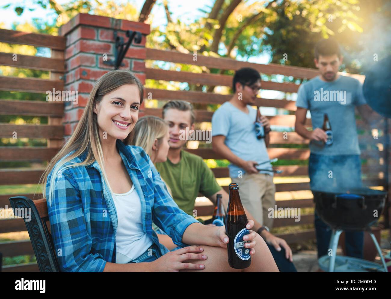 Todays chill session will be a grill session. a happy young woman ...