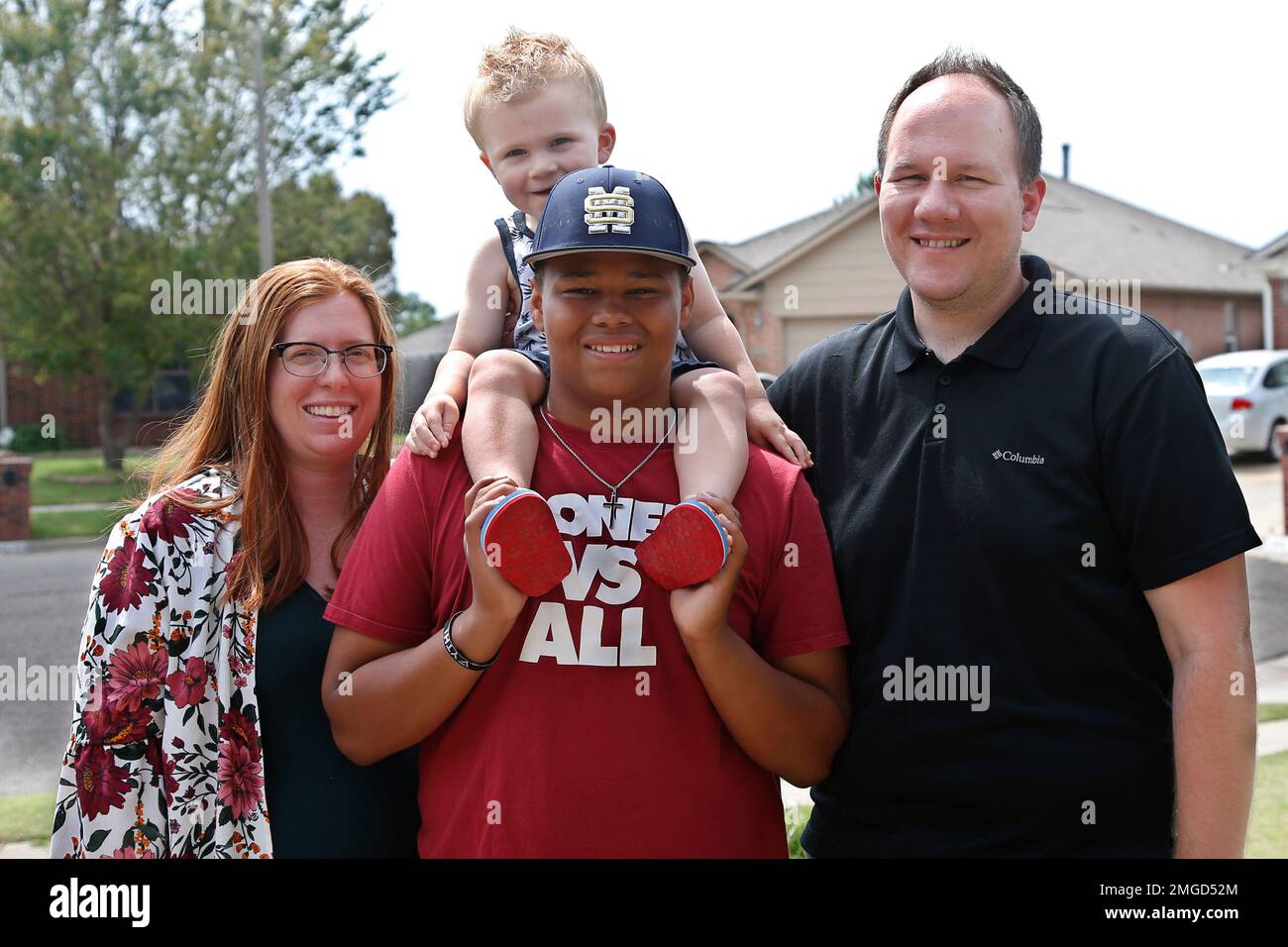 The Dunn family is pictured outside their home Friday, June 12, 2020 ...