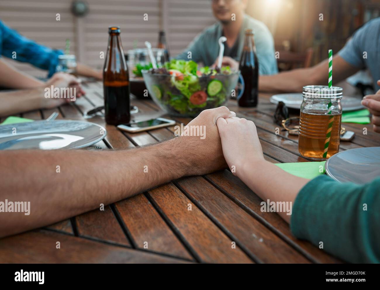 Everyone join hands. a group of young friends holding hands together ...