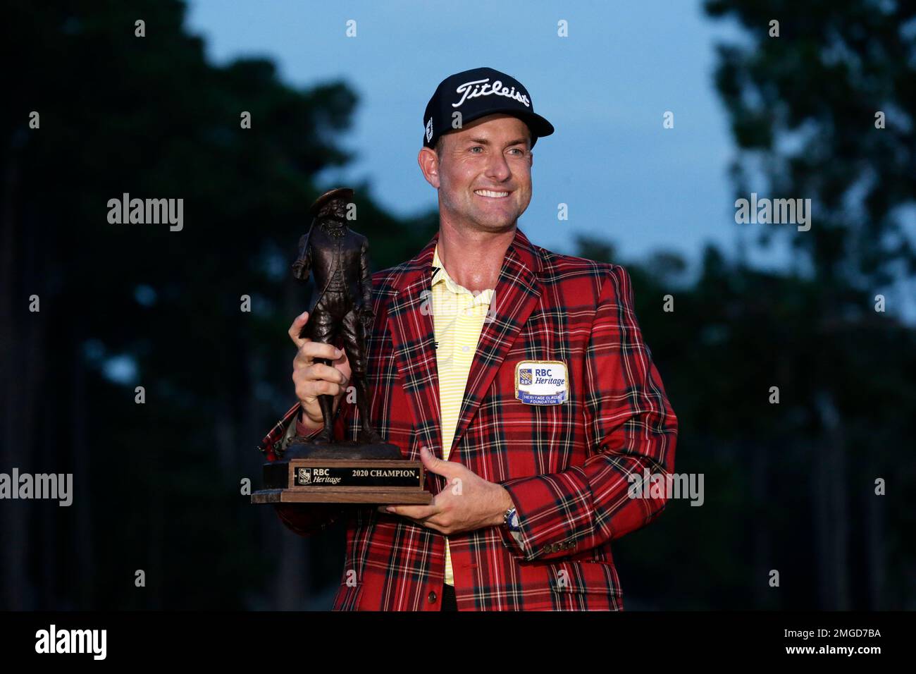 Webb Simpson holds the championship trophy after winning the RBC ...