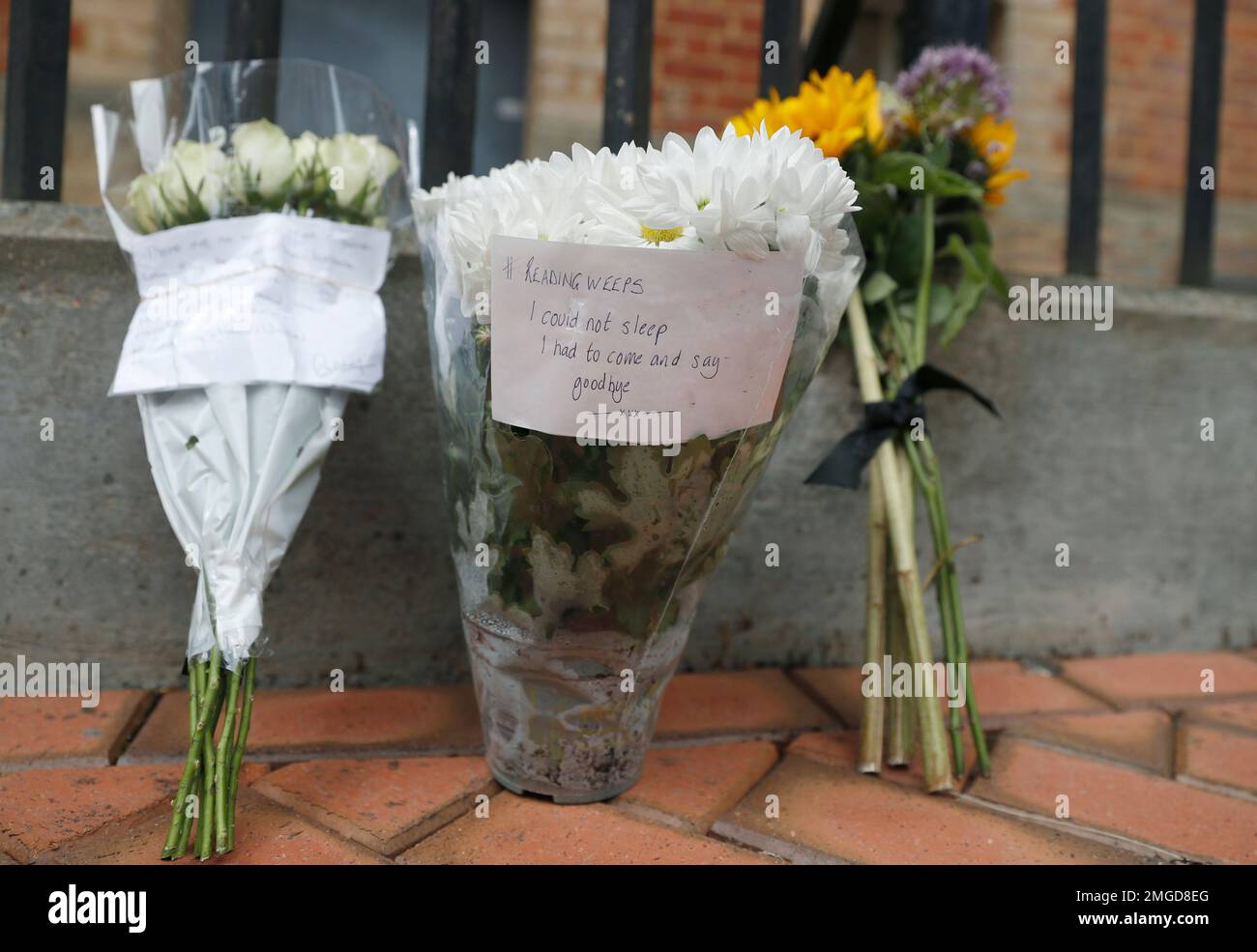Floral tributes left by the Abbey gateway of Forbury Gardens a day ...