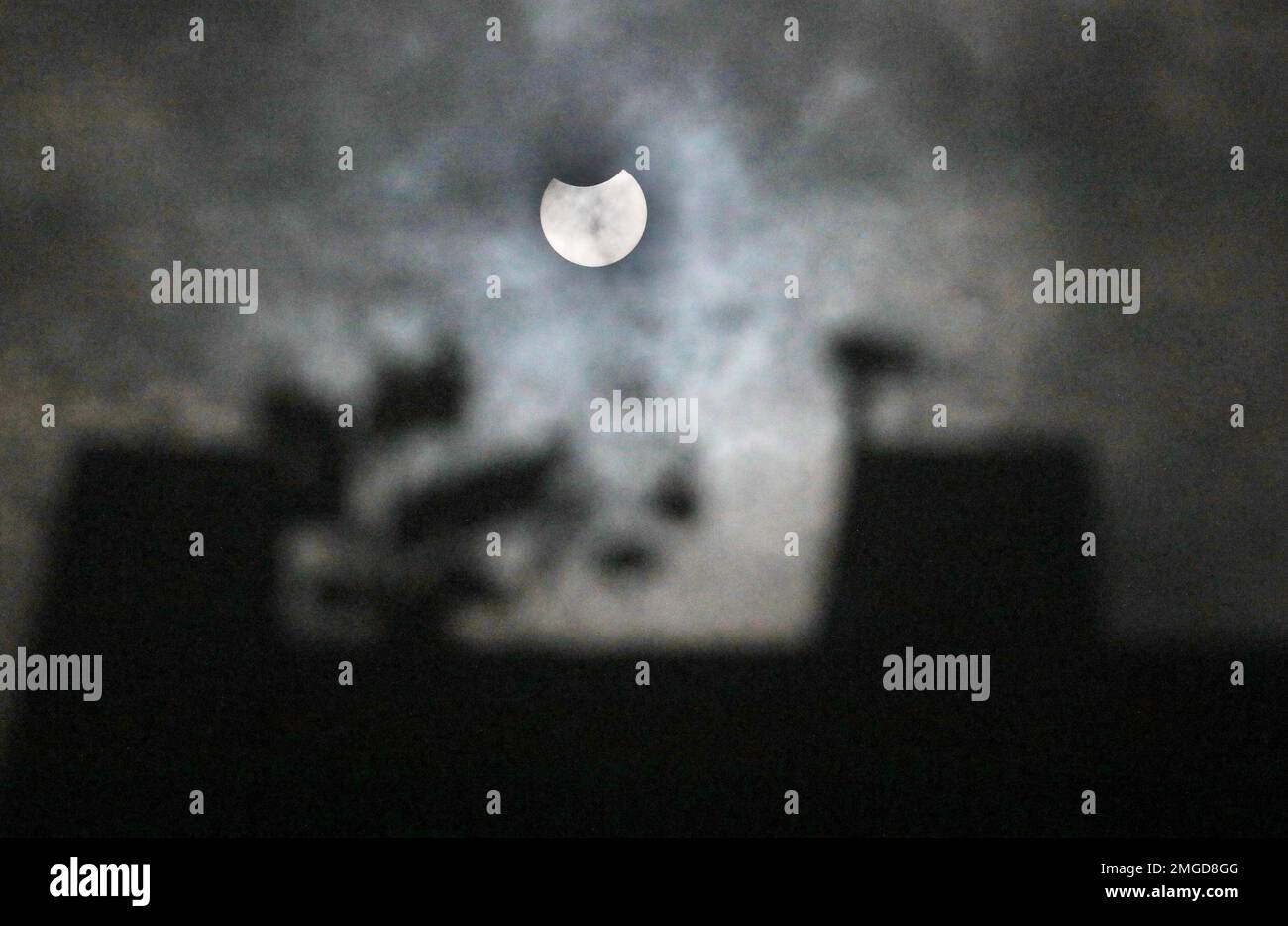 The sun forms crescent during solar eclipse in New Delhi, India, Sunday ...