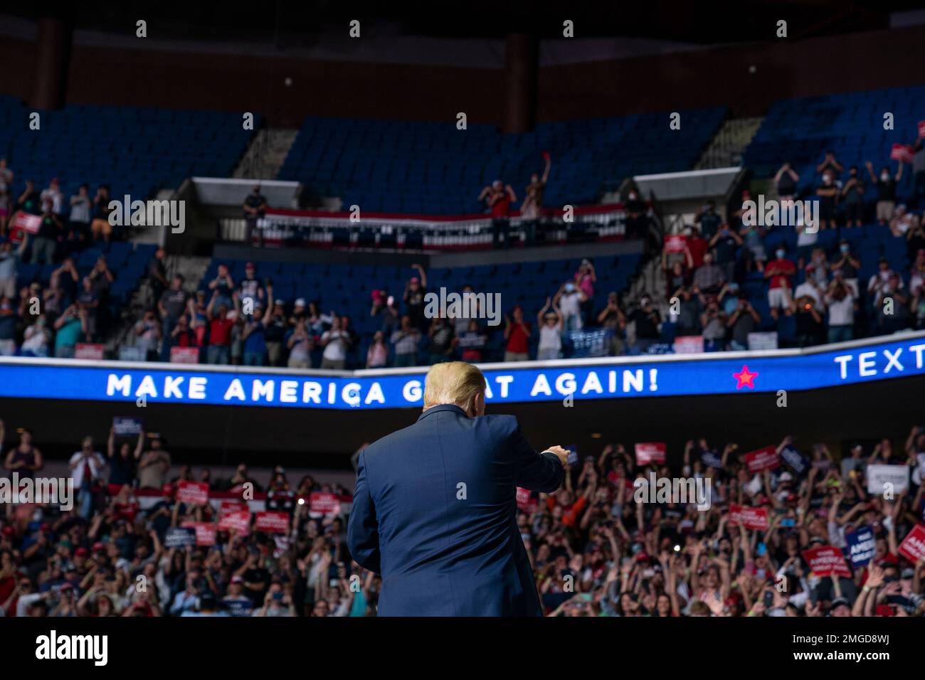 President Donald Trump arrives on stage to speak at a campaign rally at ...