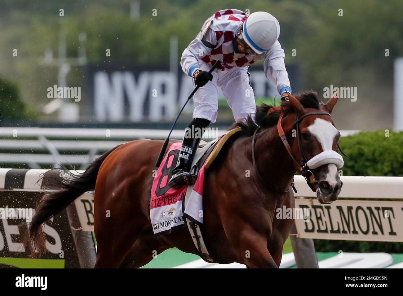 Tiz the Law (8), with jockey Manny Franco up, crosses the finish line ...