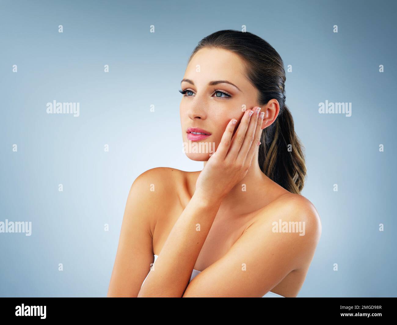 Completely flawless all year round. Studio shot of a beautiful and healthy young woman against a ...