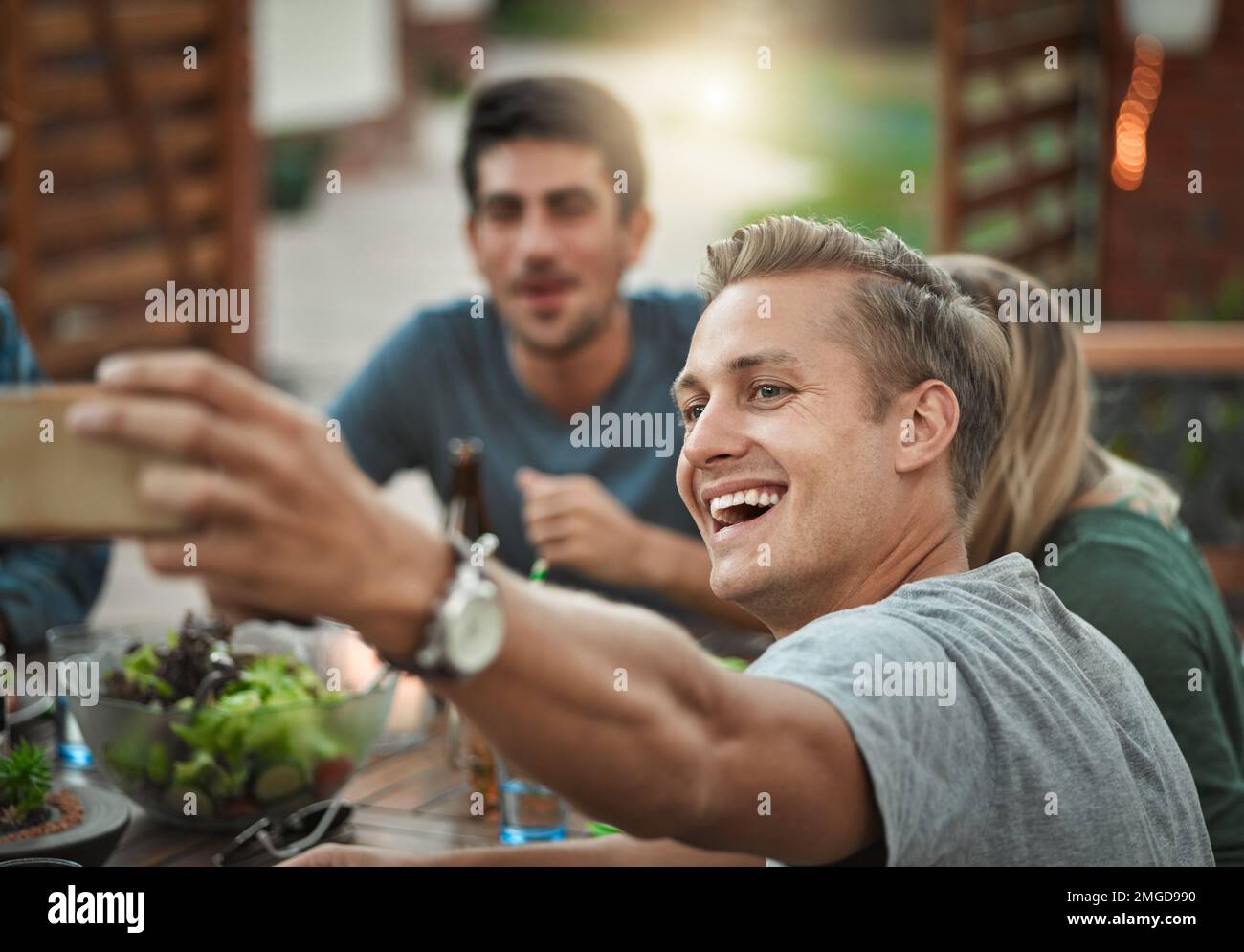 Smile for the camera everyone. a group of young friends getting closer ...