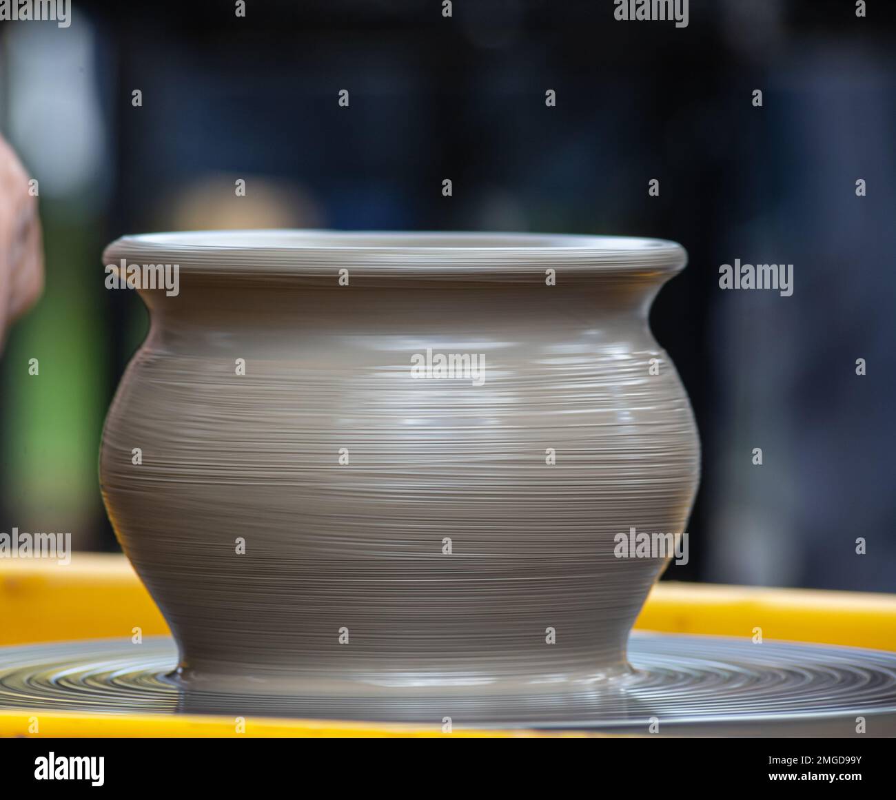 Master class on modeling of clay on a potter's wheel In the pottery ...