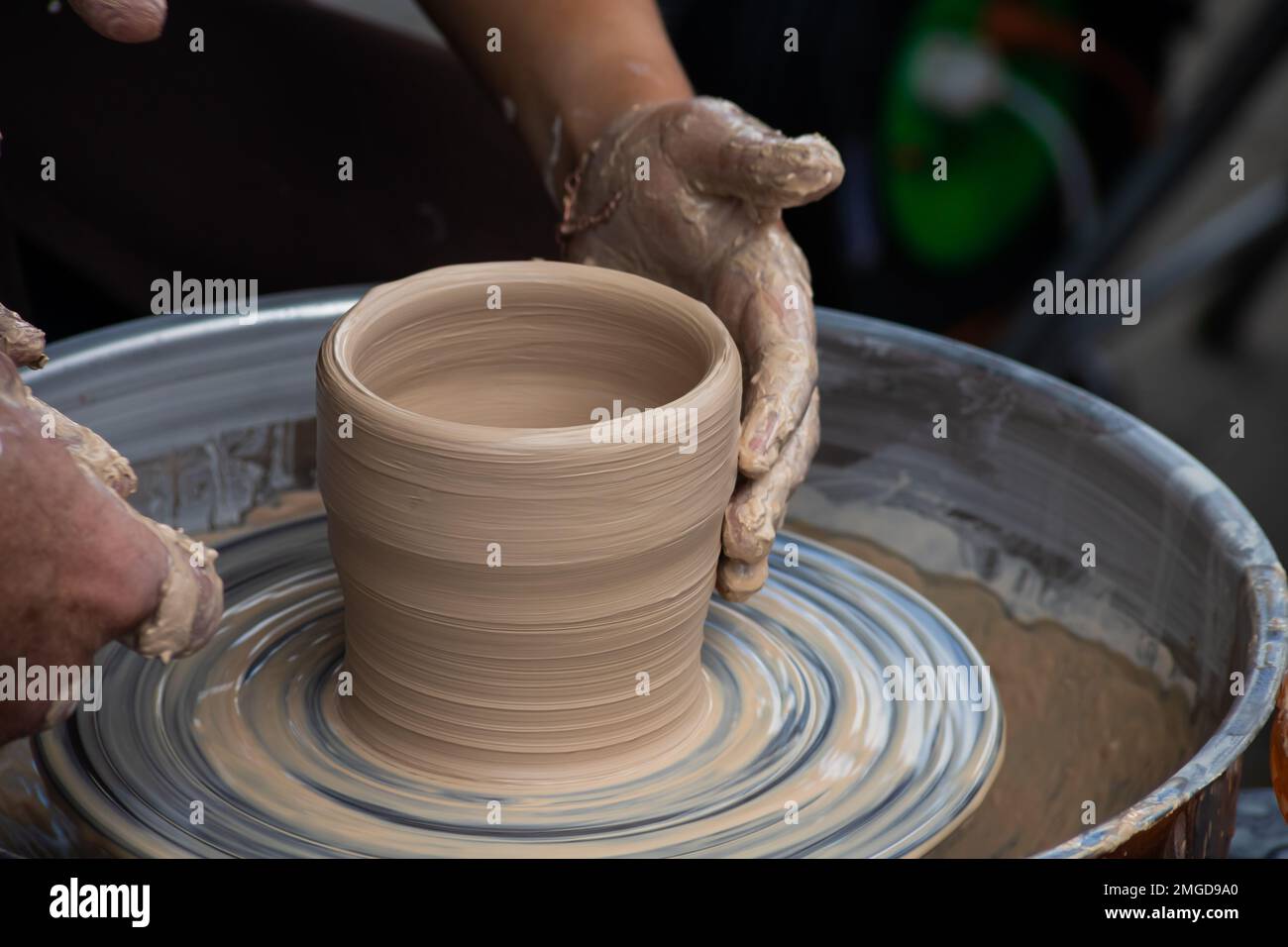 Master class on modeling of clay on a potter's wheel In the pottery ...