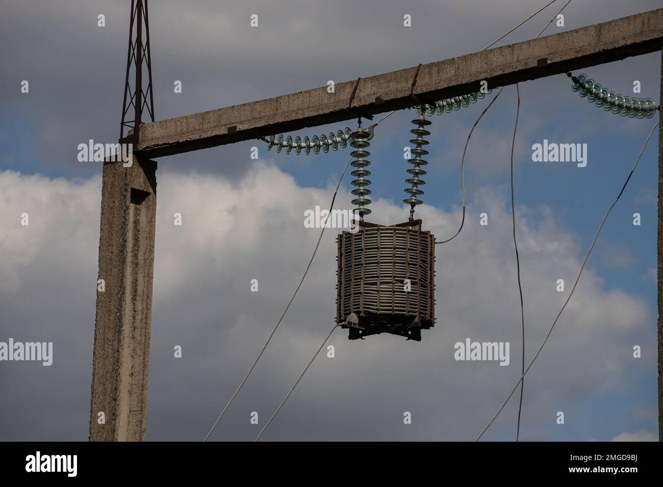Power lines on background of blue sky close-up. Electric hub on pole ...