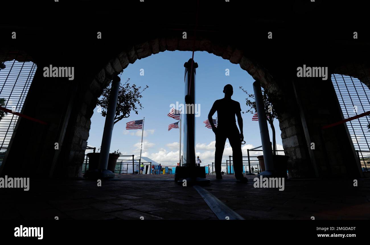 Visitors to Six Flag Fiesta Texas pass through a hands-free security ...