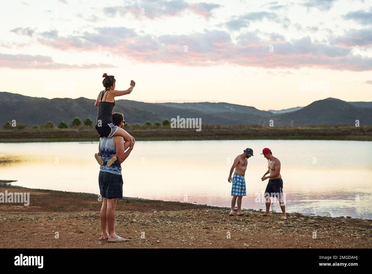 They love having fun by the water. young people spending the day ...