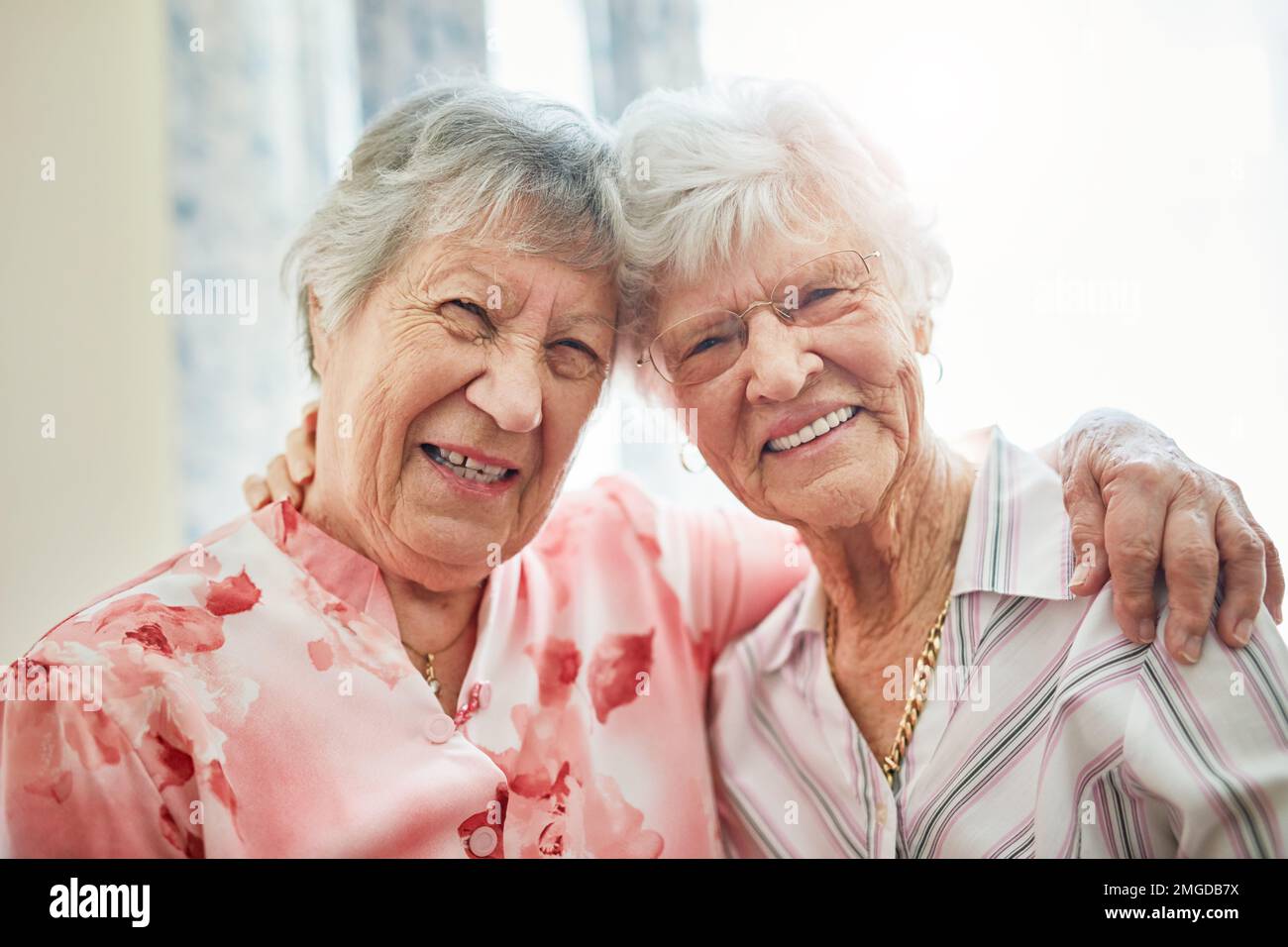 Nothing brightens up the day like a visit. Portrait of two happy ...