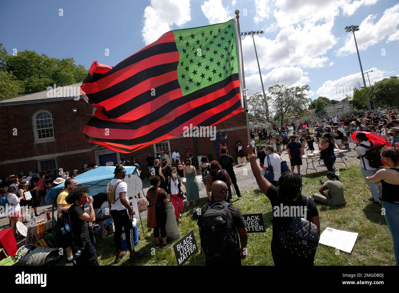 A stylized American Black Lives Matter flag flies during a Juneteenth ...
