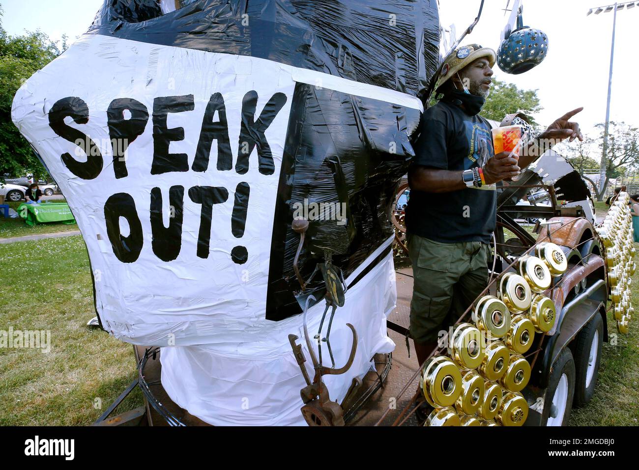 Darren Wells speaks from his float during a Juneteenth celebration ...