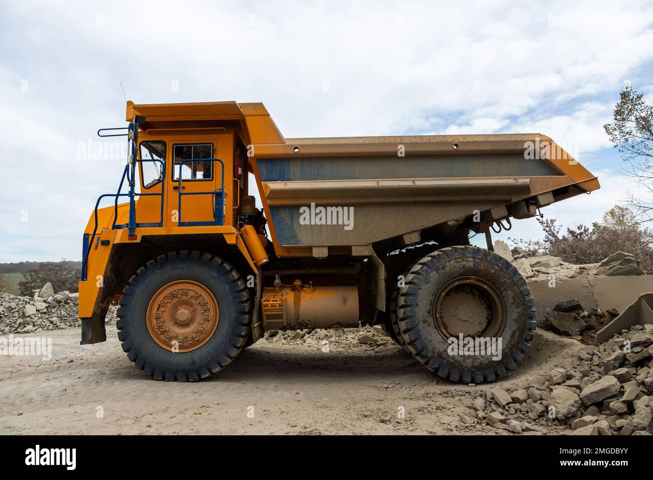 Large mining dump truck. Transport industry. Extraction of stone in an ...