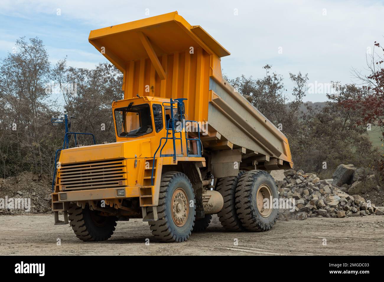 Large mining dump truck. Transport industry. Extraction of stone in an ...